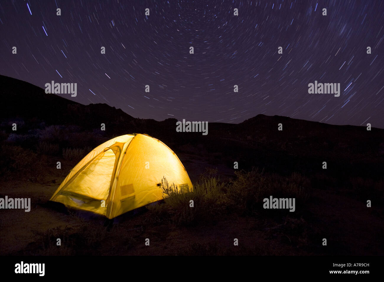 Tent at night outdoors with stars and light trails Stock Photo - Alamy