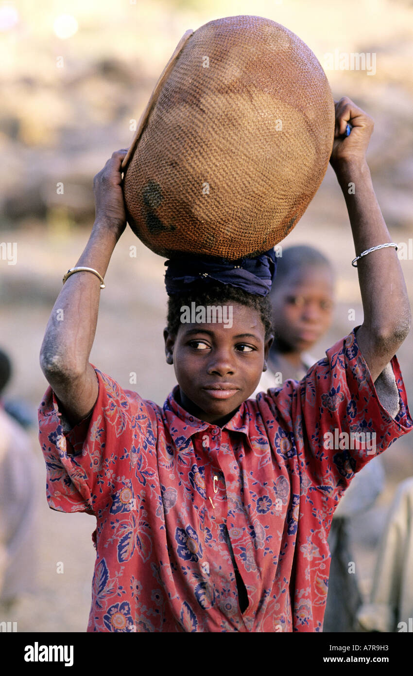 Mali, Dogon Country, Tereli, young woman wearing a canari (pottery ...