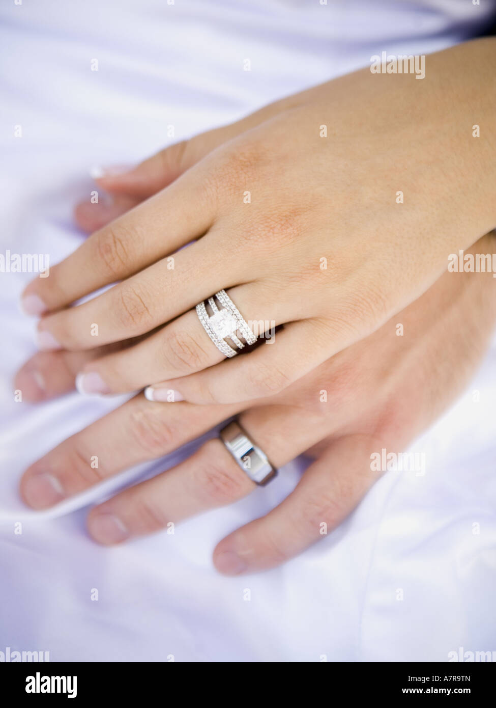 Male and female hands with wedding rings Stock Photo - Alamy