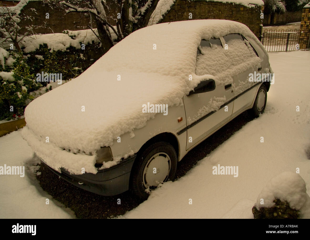 Snow Covered Car in Driveway Stock Photo - Alamy