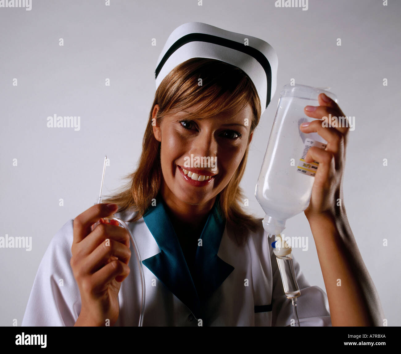 indoor studio medicine woman young 20 25 girl blonde nurse cap stripe ...