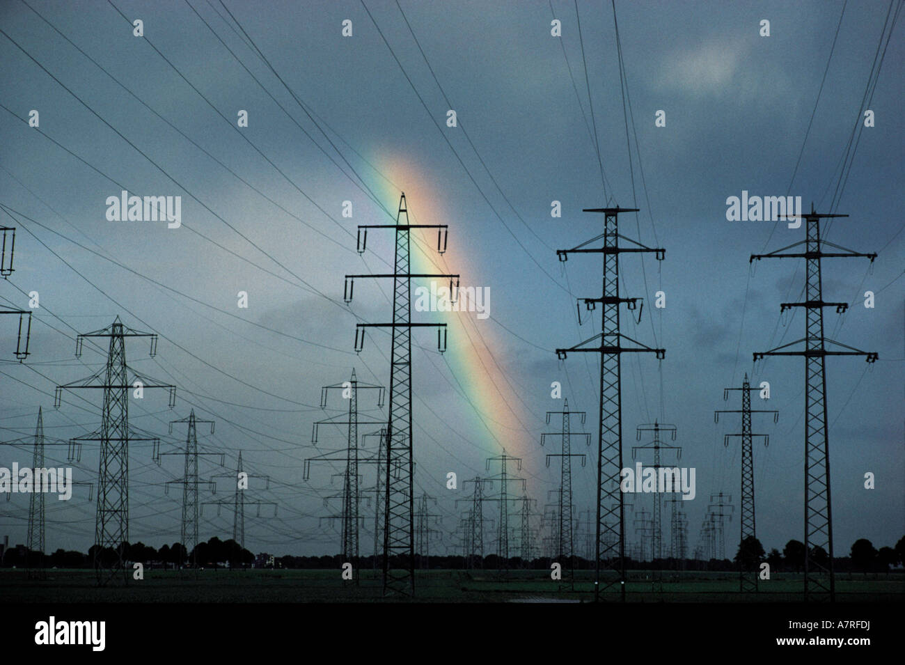 Rainbow behind electricity pylons hi-res stock photography and images ...