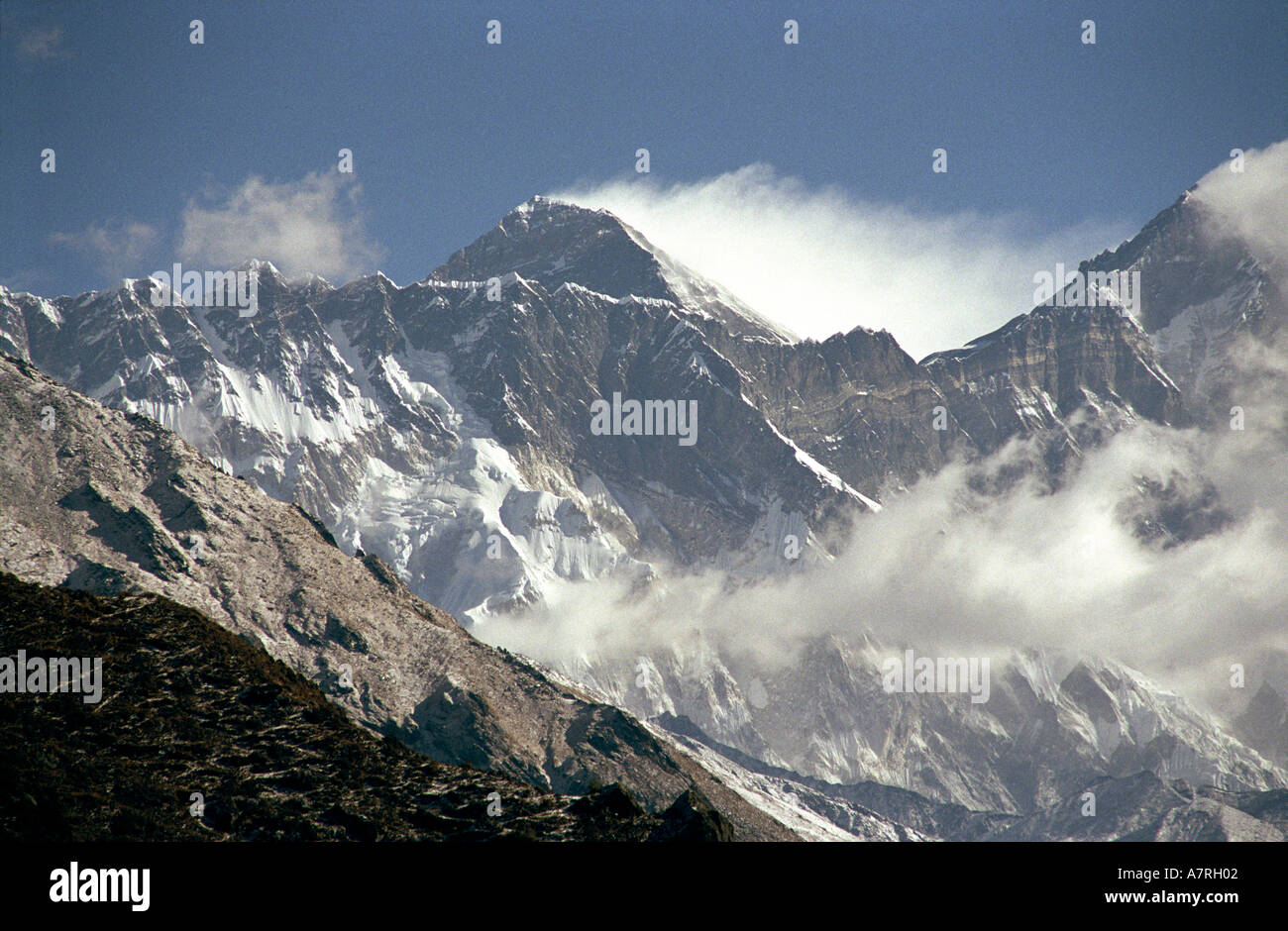 the summit of Mount everest can be seen rising from behind the Nuptse ...