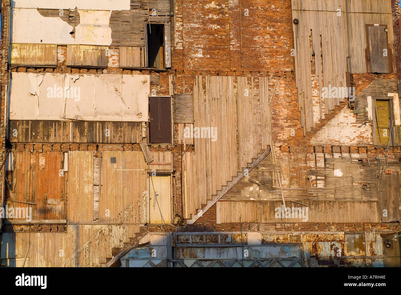 The side of a building being torn down creates a pattern of wood and ...
