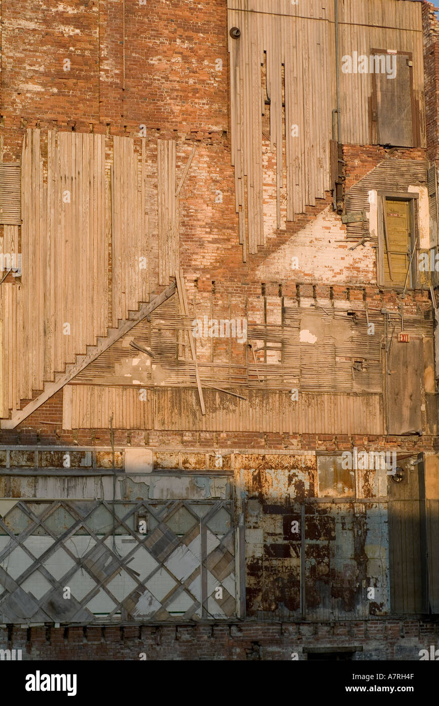 The side of a building being torn down creates a pattern of wood and ...