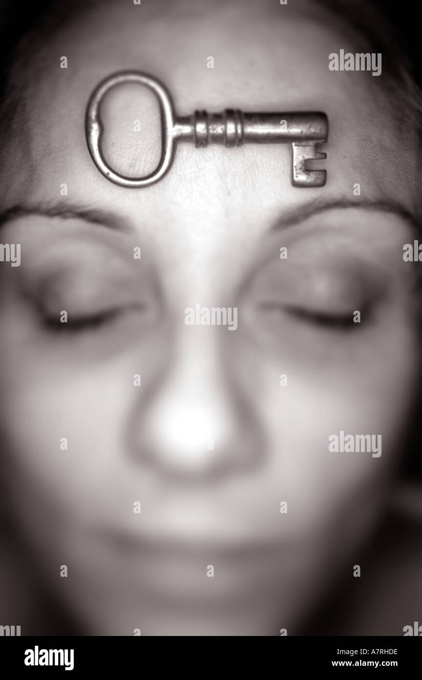 Woman with key on head Stock Photo - Alamy