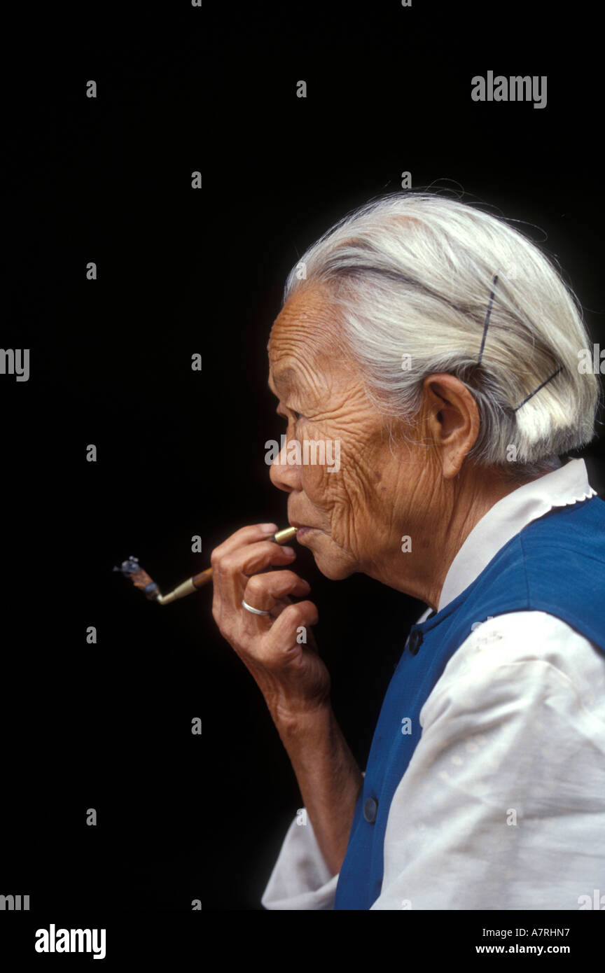 China Hubei Province Wushan Tian Yu Qun smokes her pipe at home by ...