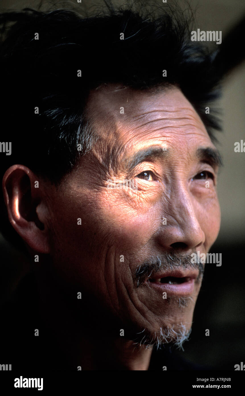China Sichuan Province Fengjie Portrait of merchant at street market in ...