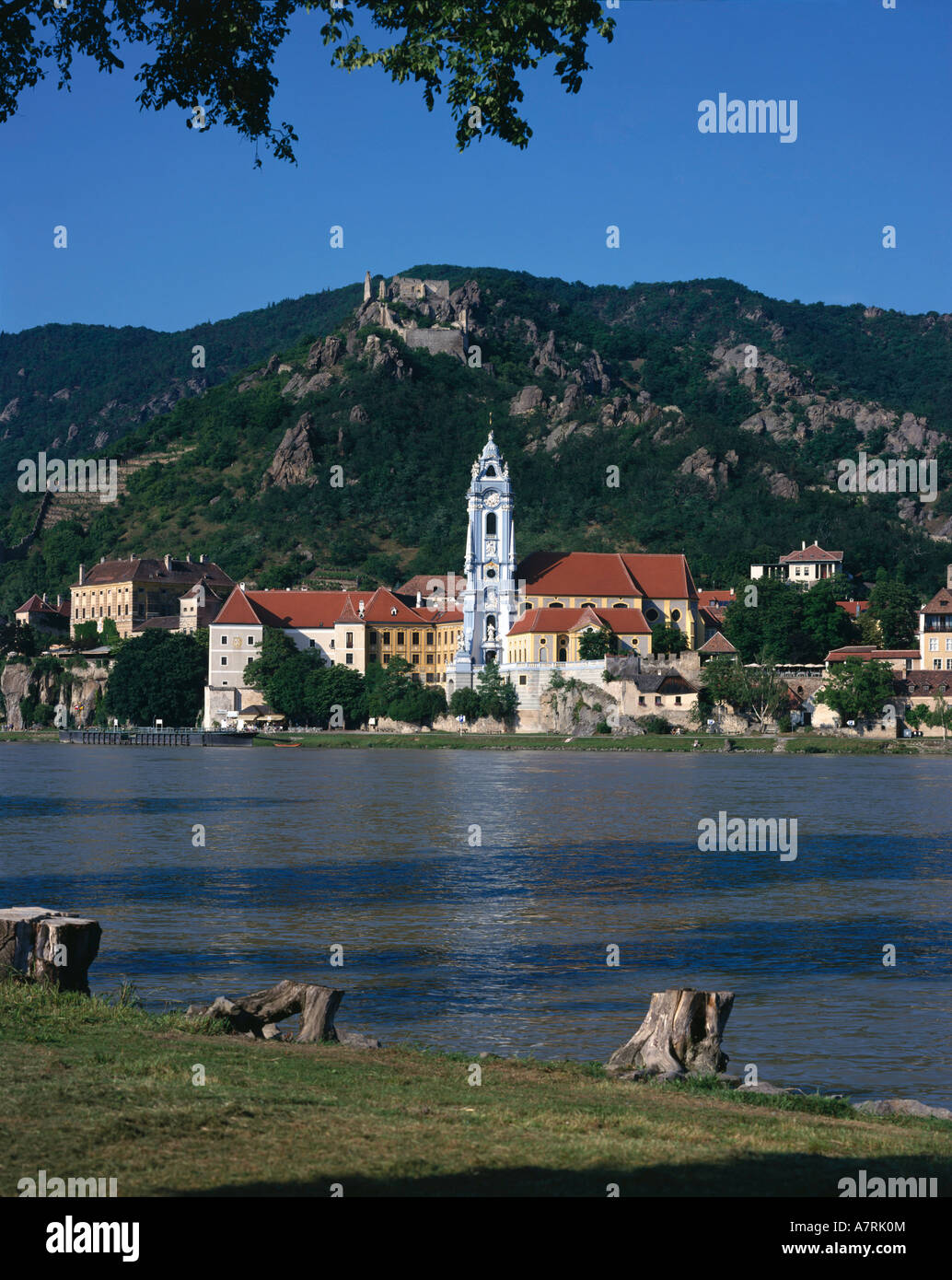 Town at waterfront with castle on hill in background, Duernstein Castle ...