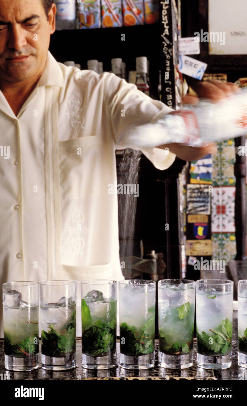 Cuba, Havana, Bodeguita del Medio, barman making Mojito, the national ...