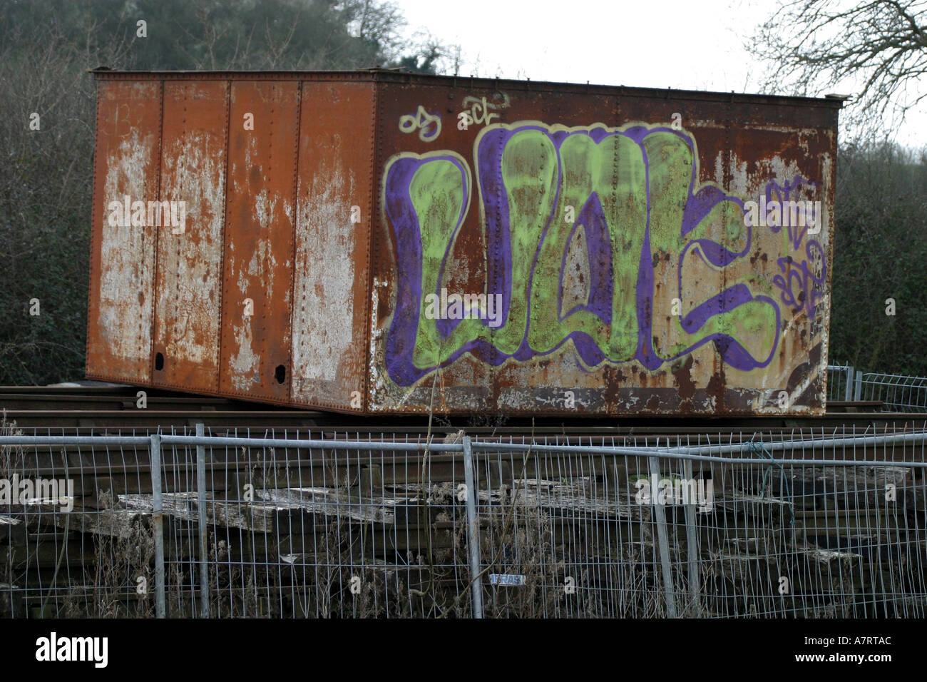 Graffiti on the side of a rusty old fuel tank Stock Photo - Alamy