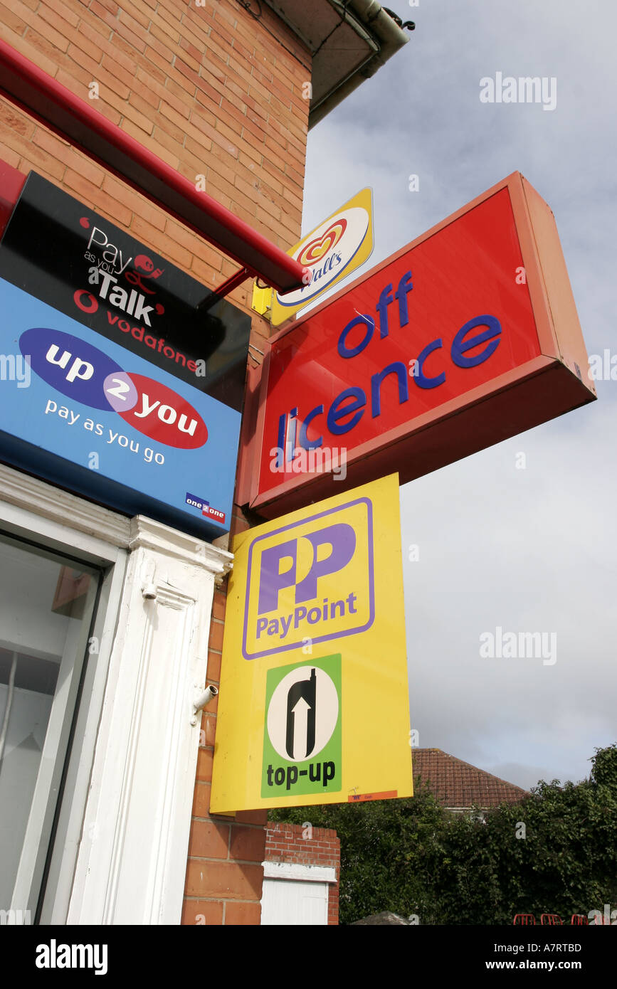 Advertising signs outside newsagents shop Stock Photo - Alamy