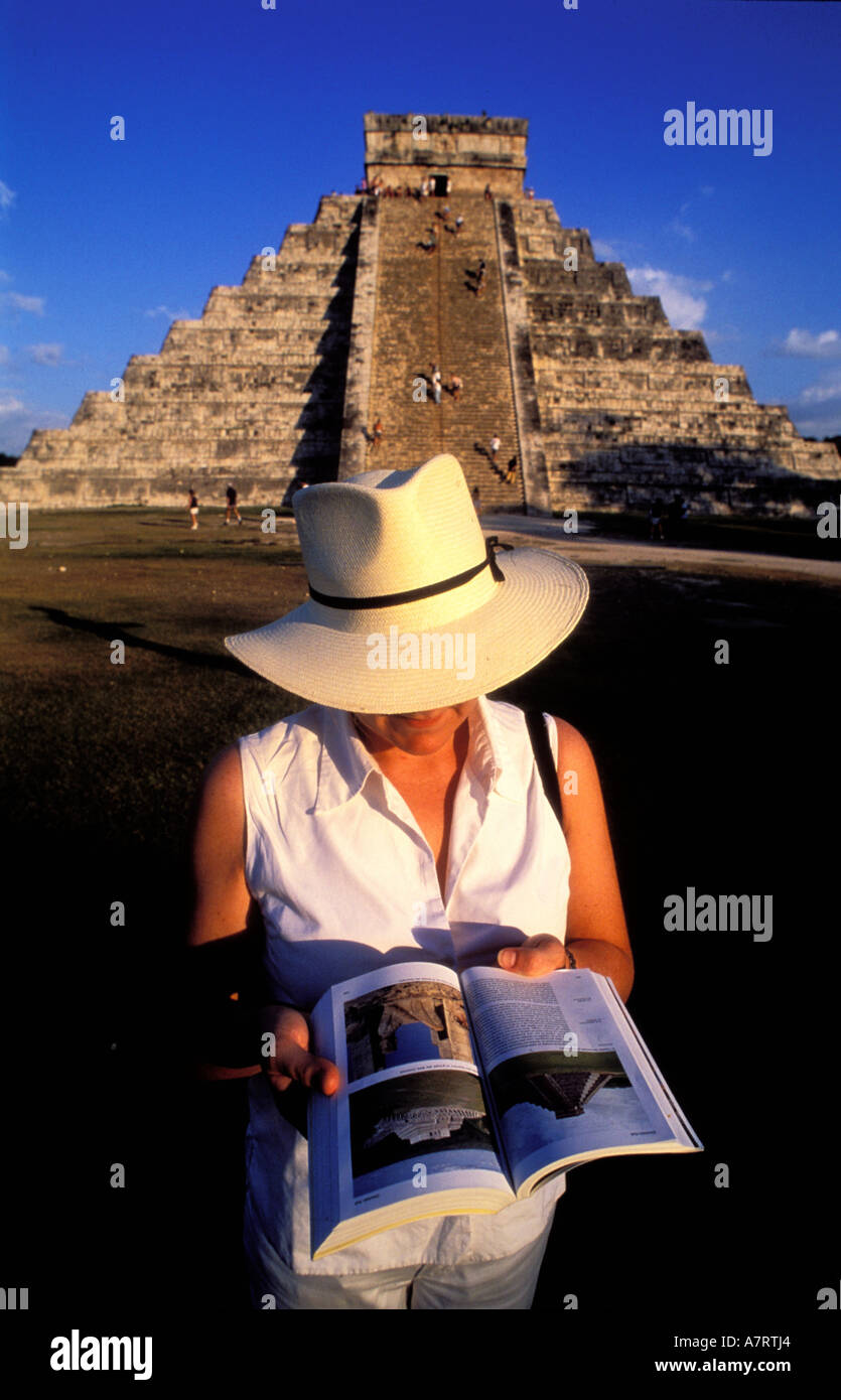 Mexico, Yucatan State, Chichen Itza, tourist reading a book, (Model ...