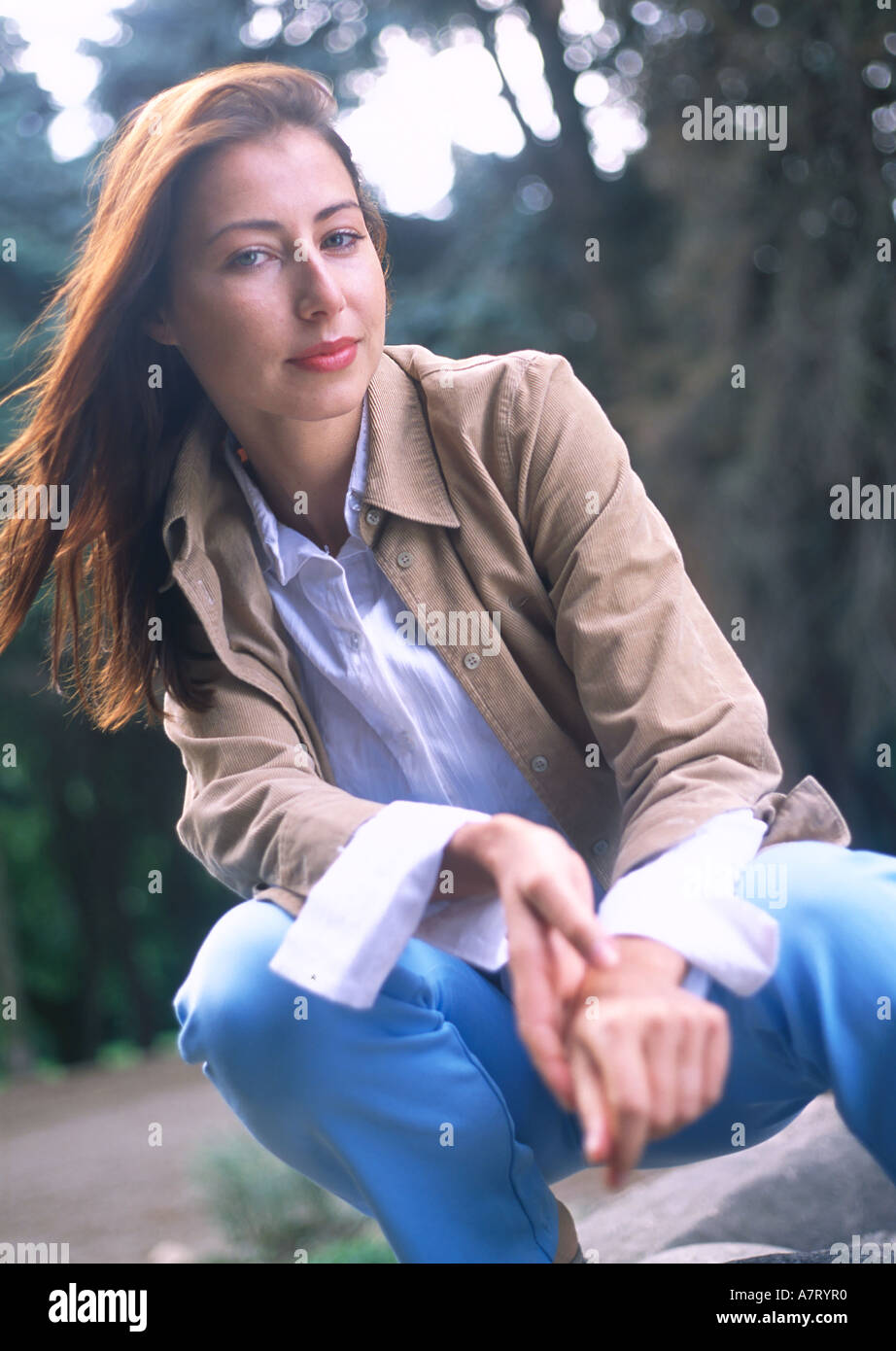 outdoor summer day park tree trees close up woman young girl 20 25 ...