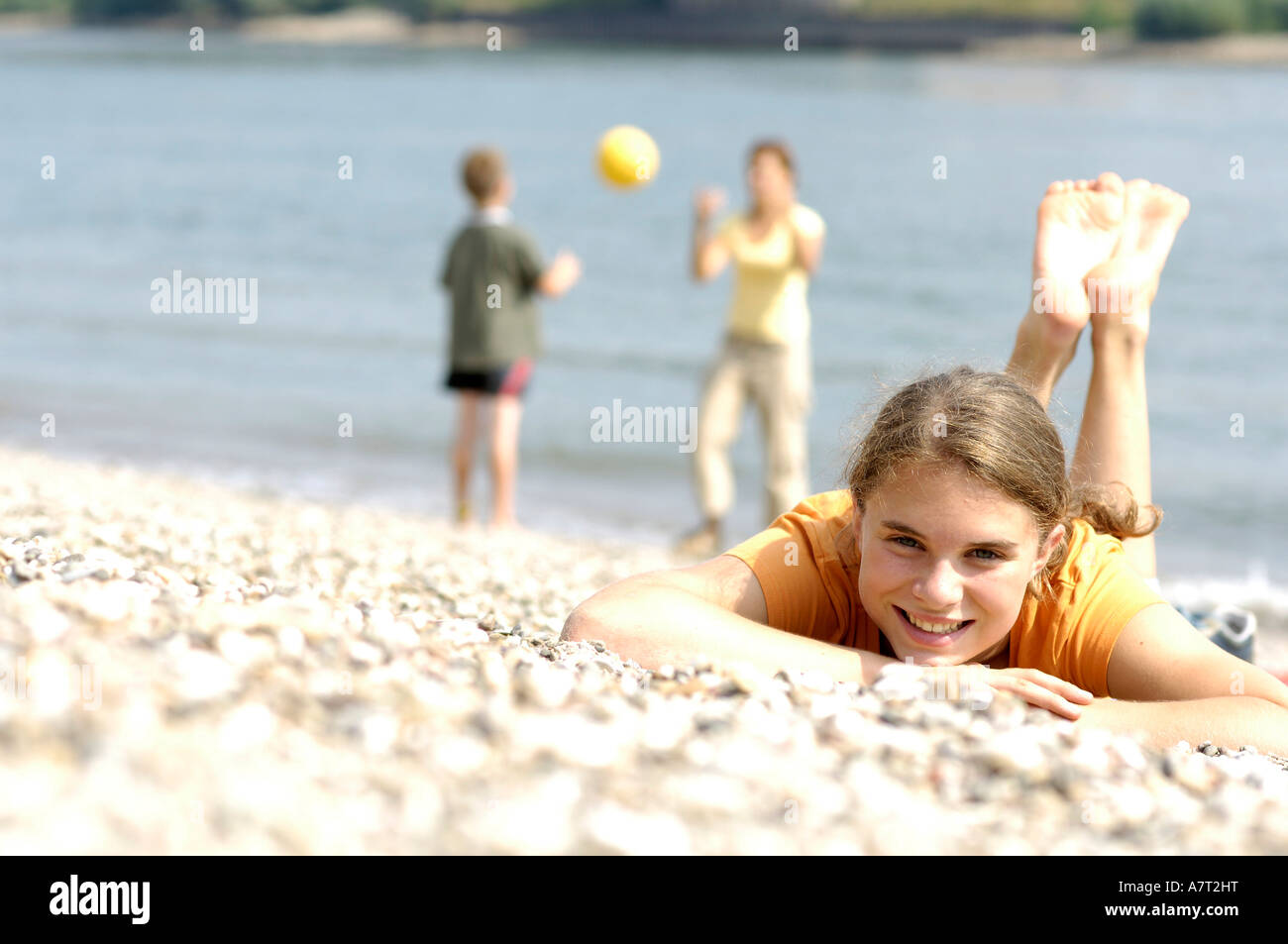 Portrait of teenage girl lying on beach and smiling Stock Photo - Alamy Portrait of teenage girl lying on beach and smiling Stock Photo - Alamy