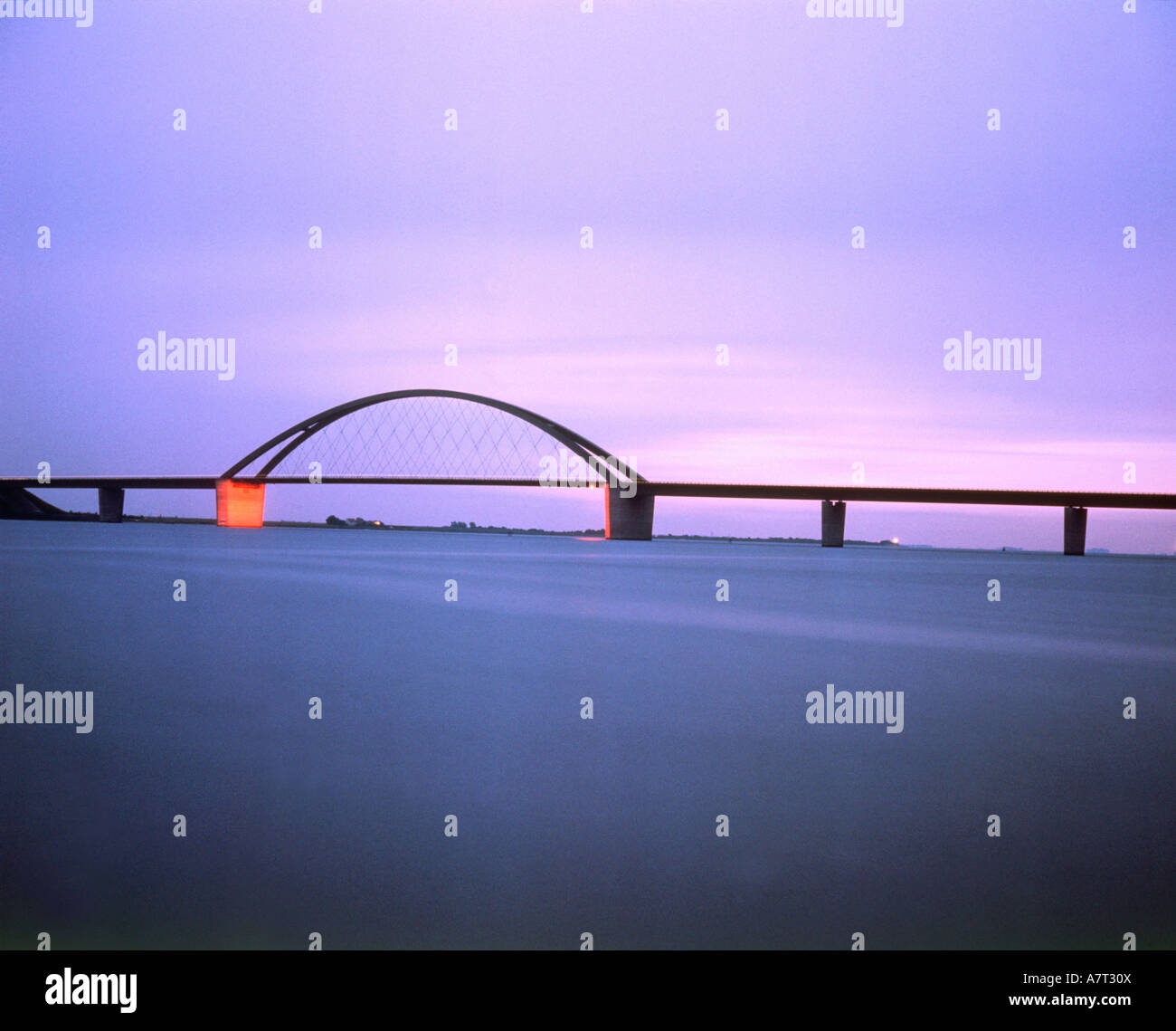 Bridge across river at dusk Stock Photo - Alamy