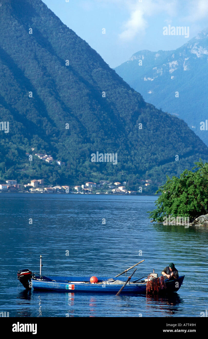 Fisherman fishing in lake, Lake Como, Lombardy, Italy Stock Photo - Alamy