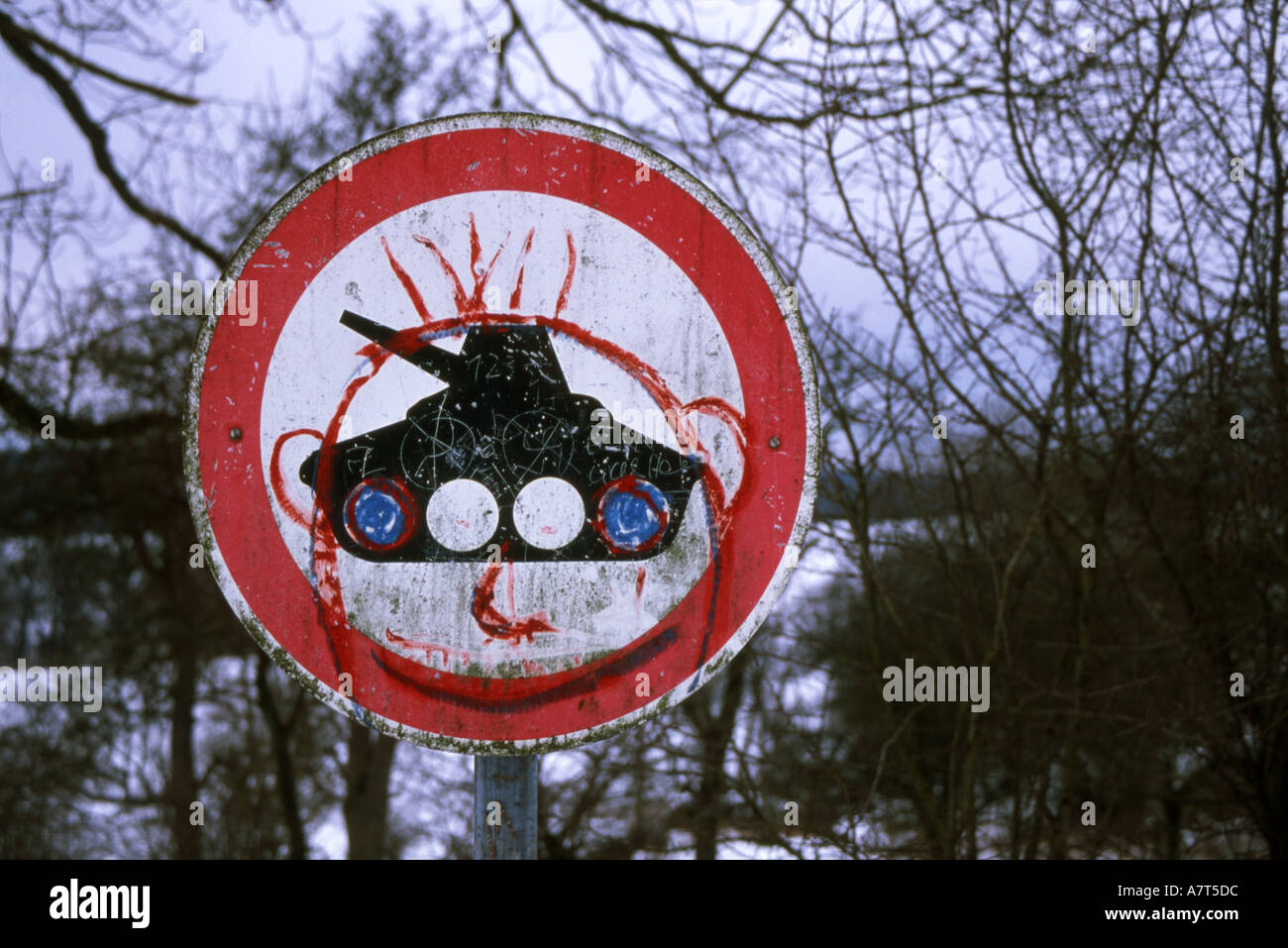 Warning sign in Germany displaying a tank symbol on which a smiling ...