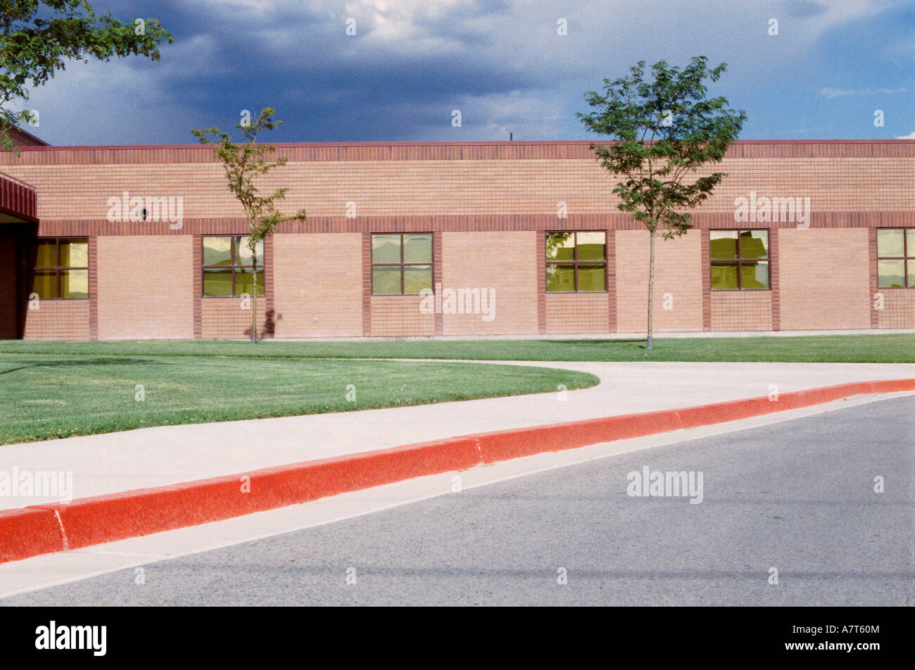 Trees in front of building Stock Photo - Alamy