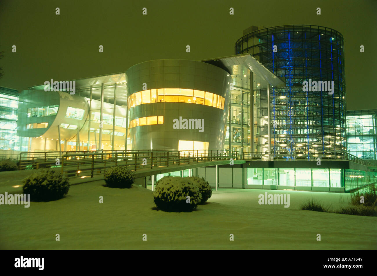 Office buildings lit up at night Stock Photo - Alamy