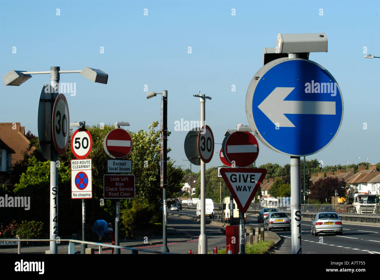 Confusing Road signs at a busy junction in South London England Stock ...
