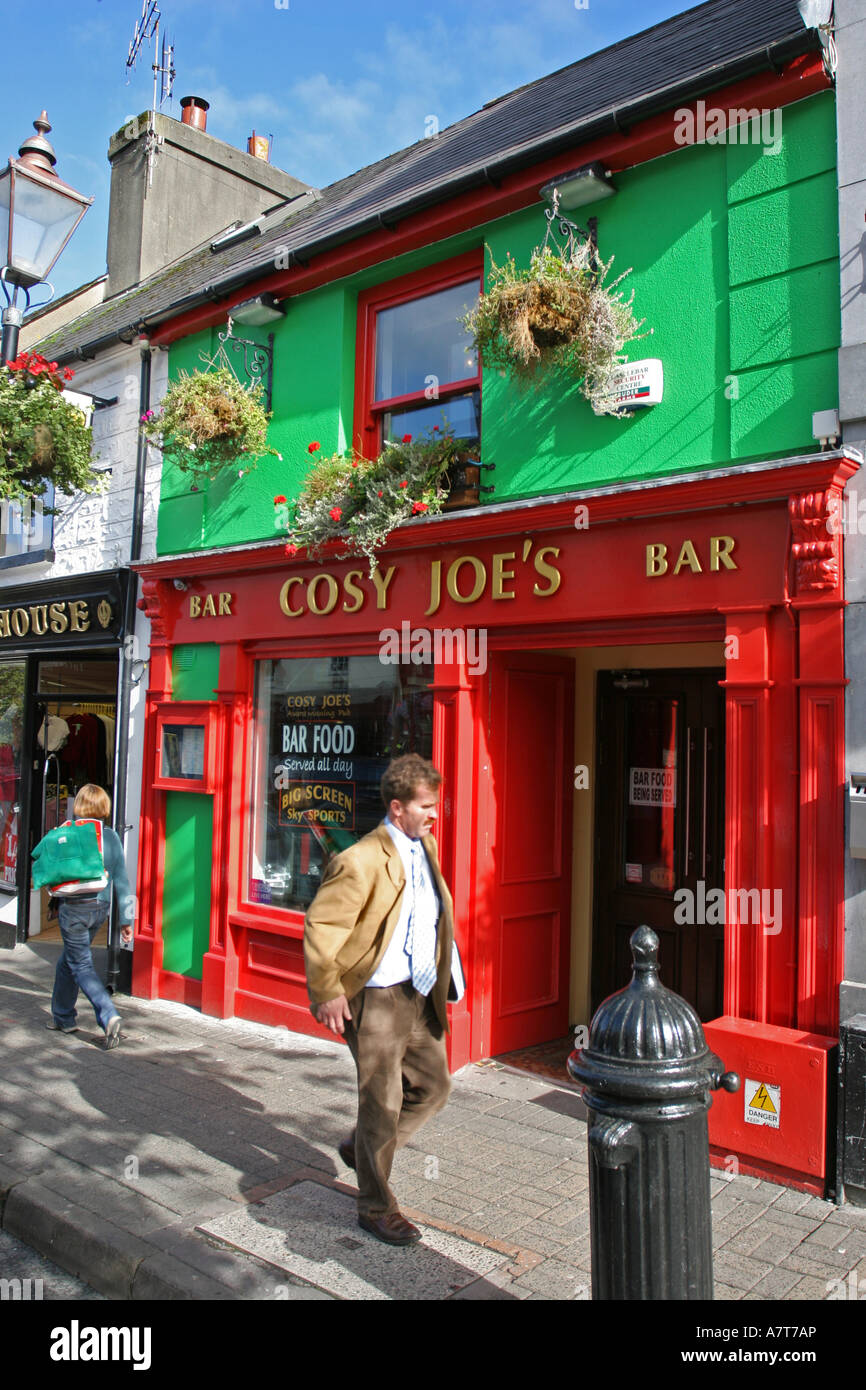 Two people walking in front of bar on street Bridge Street Republic of ...