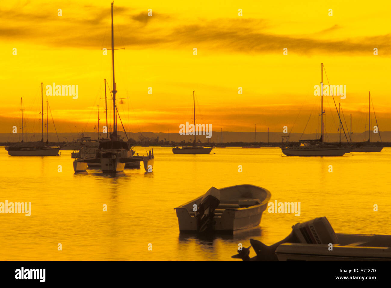 Boats in a Harbor at Sunset Stock Photo - Alamy