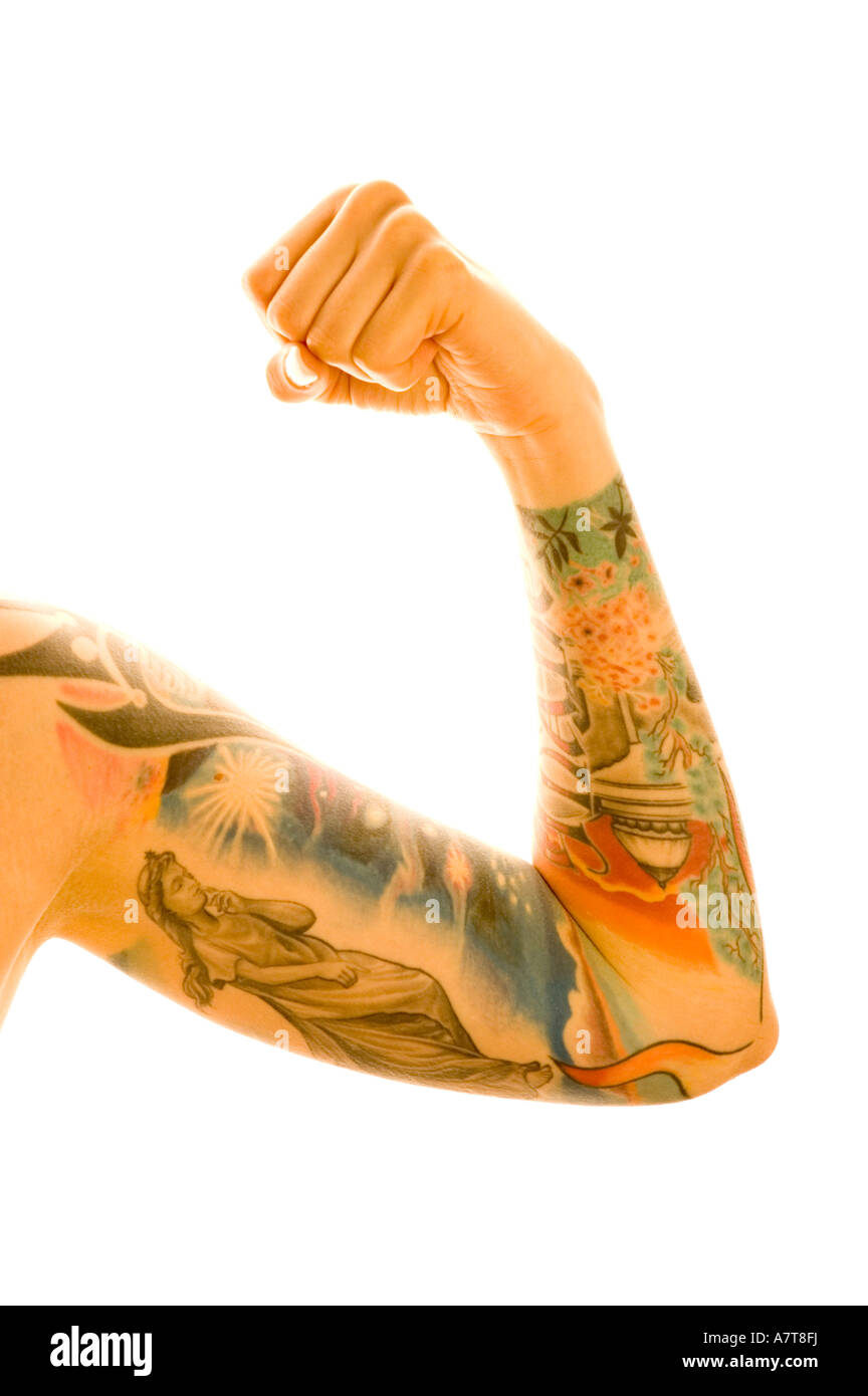 Man flexing his tattooed muscles Stock Photo - Alamy