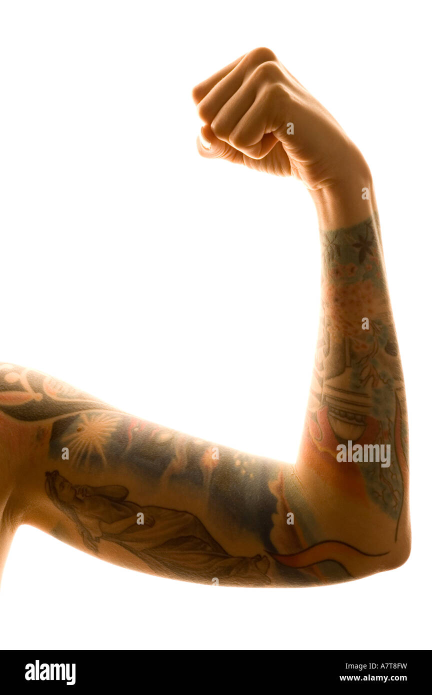 Man flexing his tattooed muscles Stock Photo - Alamy