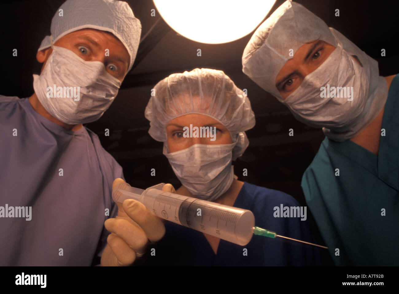 Scary Doctors Giving an Injection Stock Photo - Alamy
