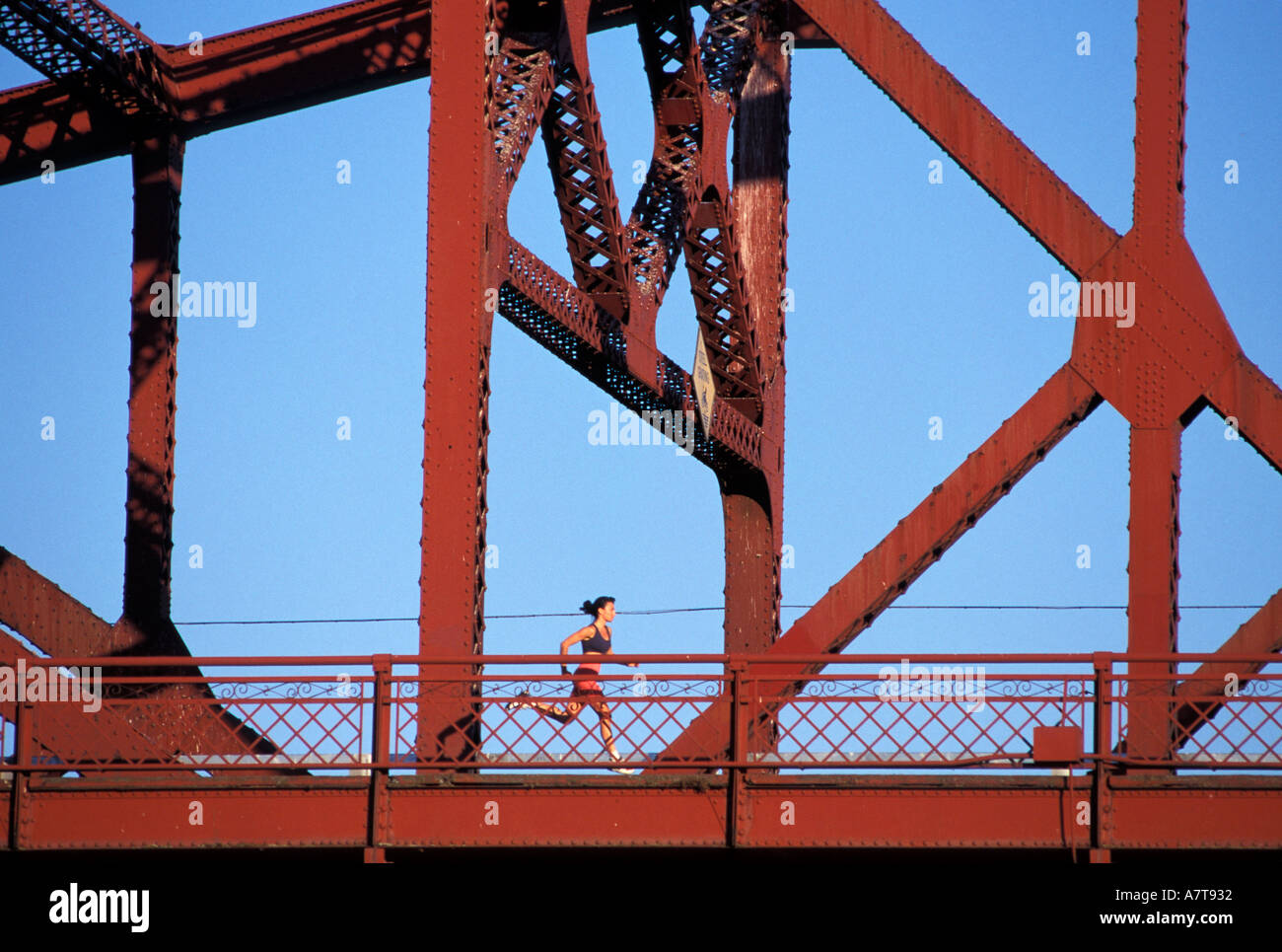 Female athlete running across bridge hi-res stock photography and ...