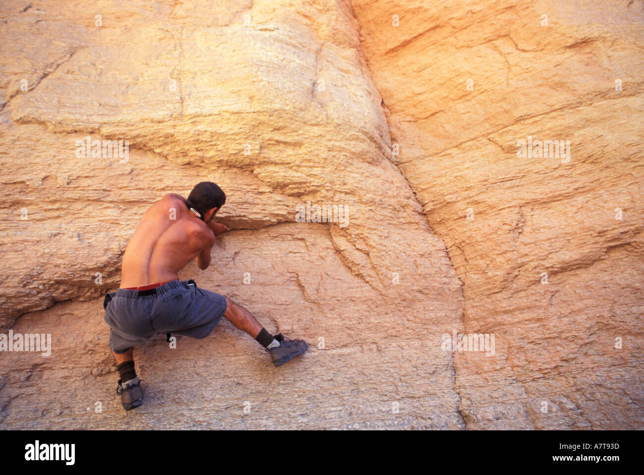 Man Rock Climbing With No Ropes Stock Photo - Alamy
