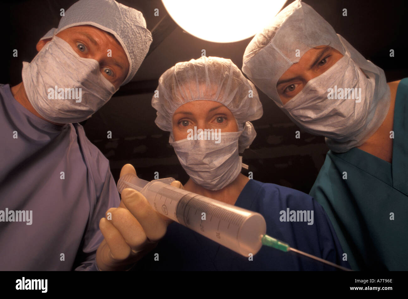 Scary Doctors Giving an Injection Stock Photo - Alamy