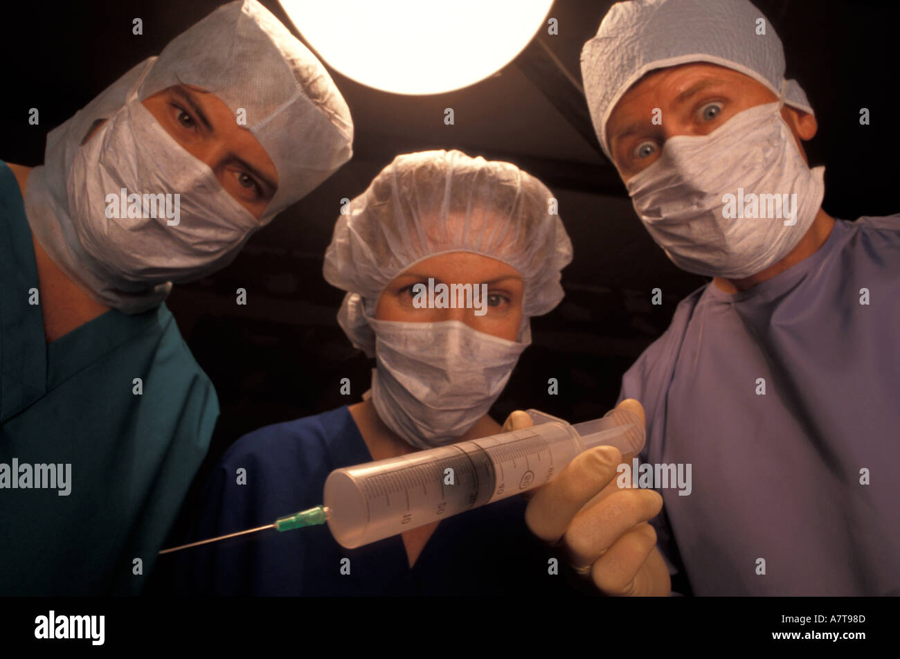 Scary Doctors Giving an Injection Stock Photo - Alamy