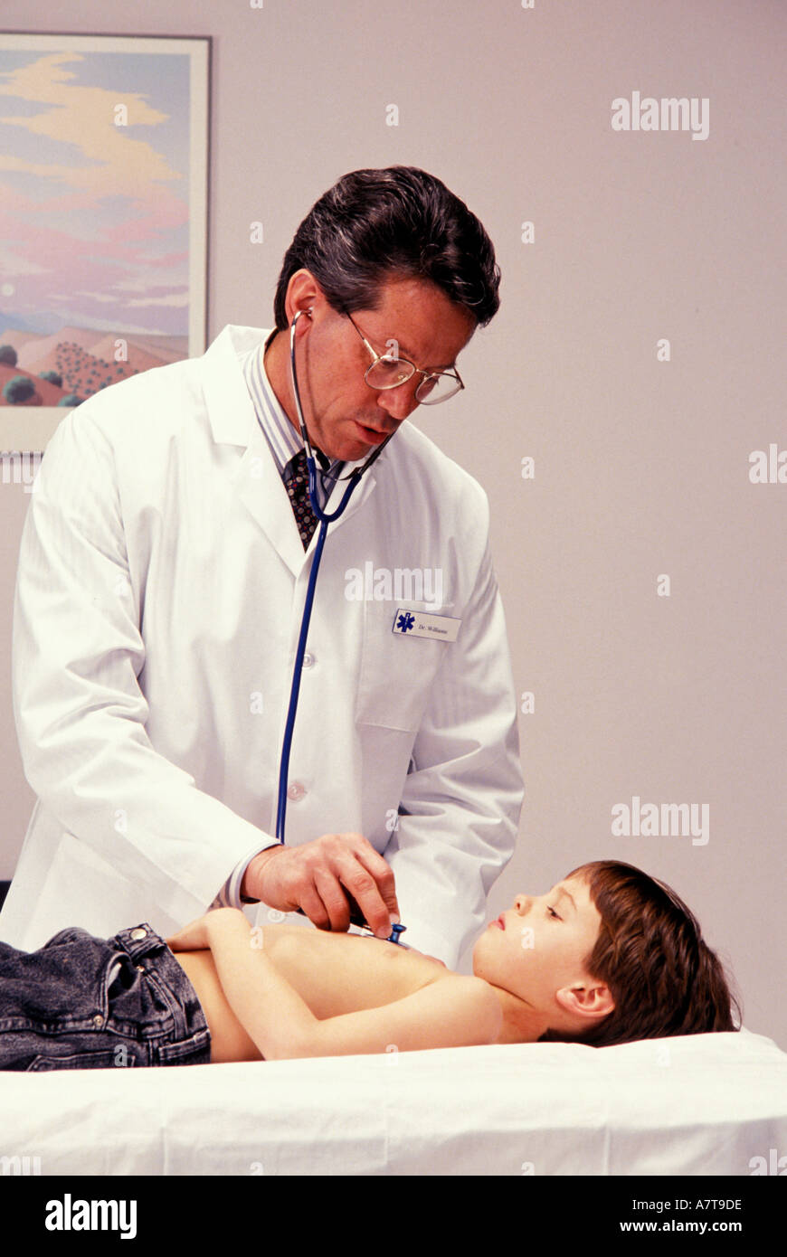 Doctor Listening to Little Boy s Heart Stock Photo - Alamy