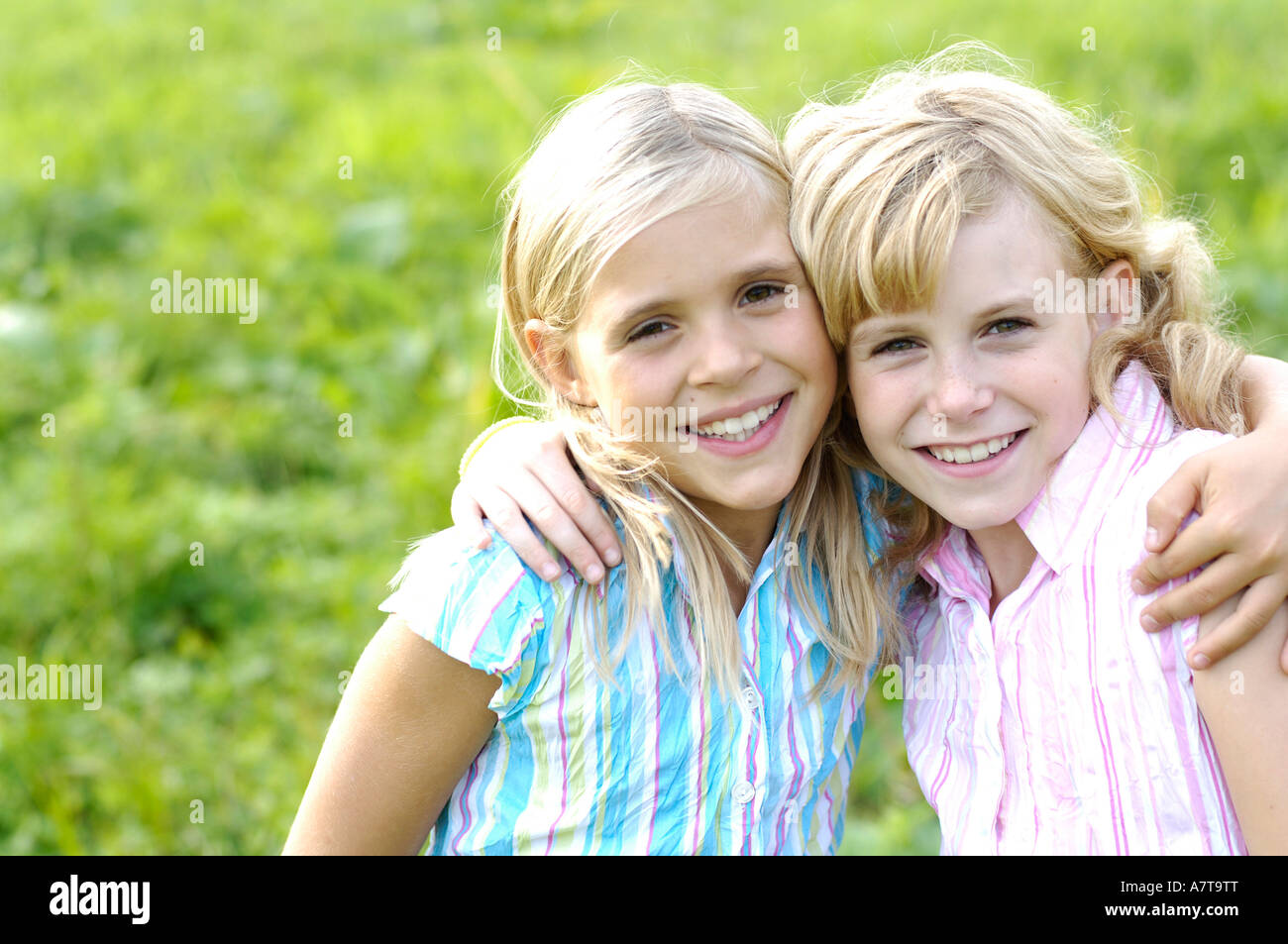 Portrait of two girls smiling Stock Photo - Alamy