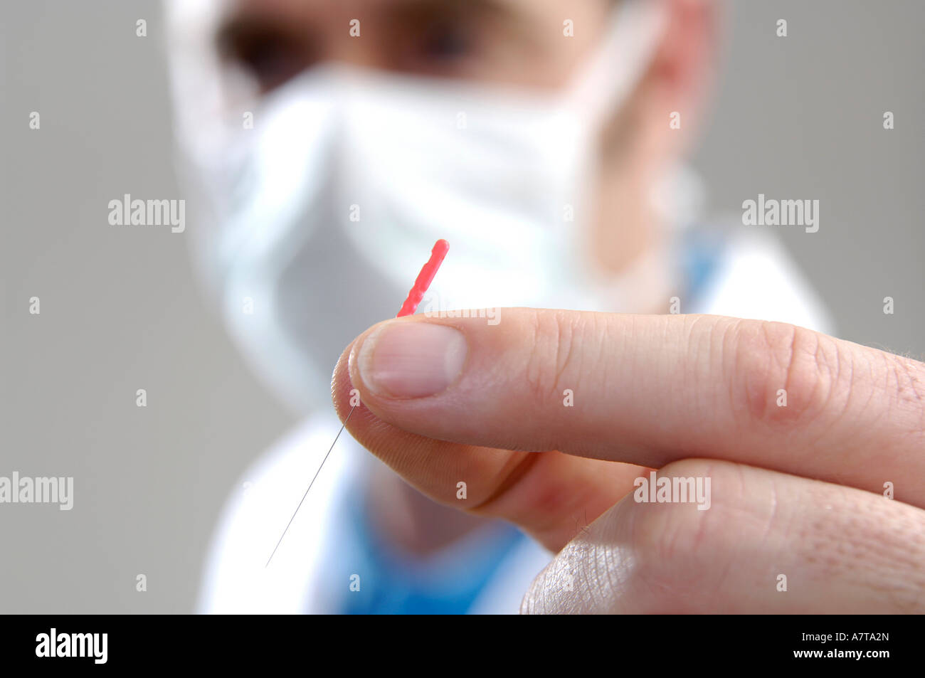 Doctor holding acupuncture needles hi-res stock photography and images ...