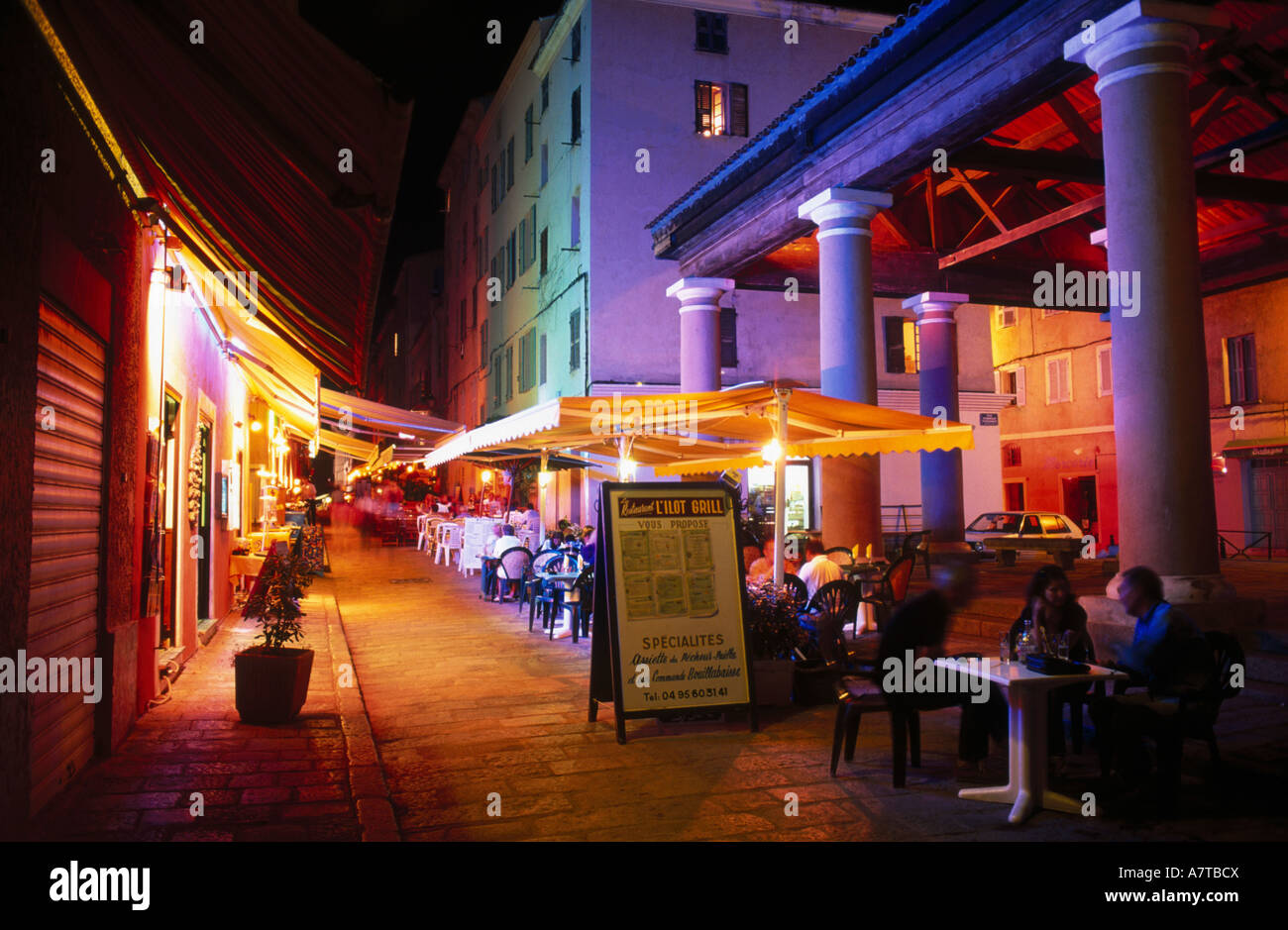 Sidewalk cafe lit up at night France Stock Photo - Alamy
