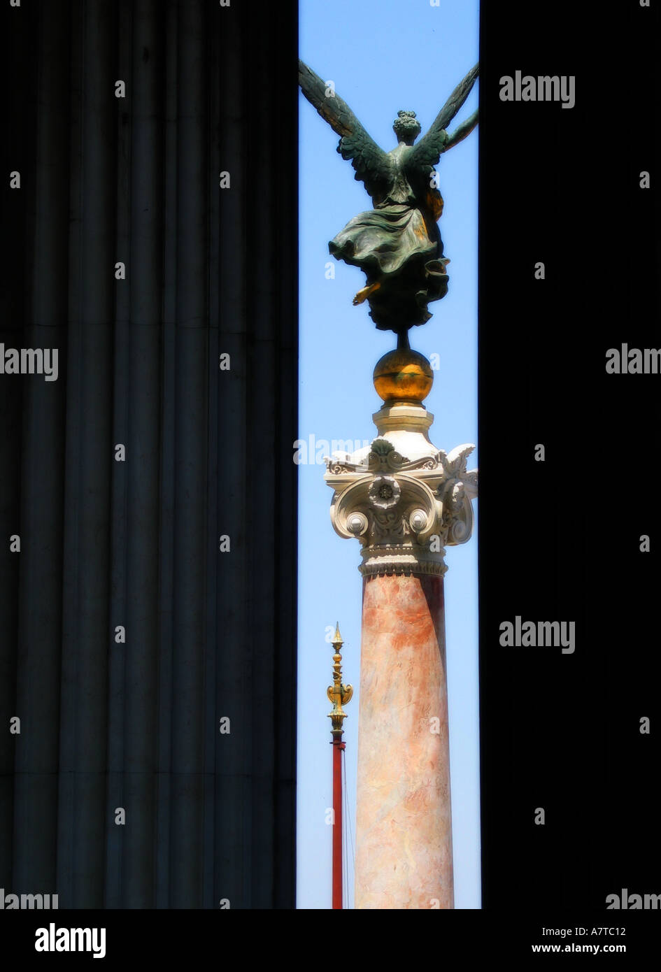 View of angel through columns Stock Photo - Alamy