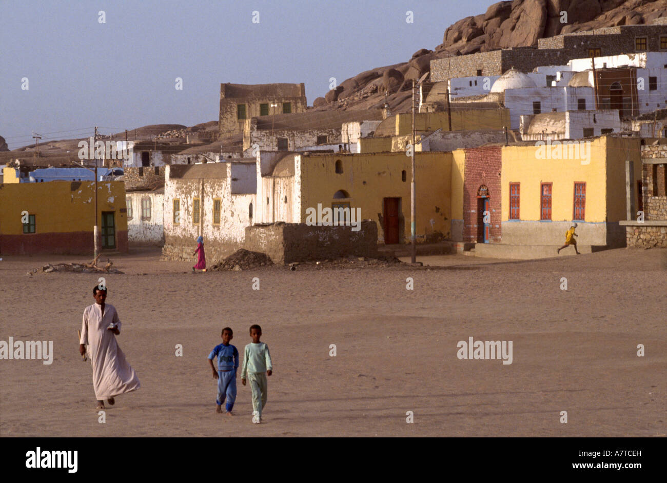 Native person with two children in village Aswan Egypt Stock Photo - Alamy