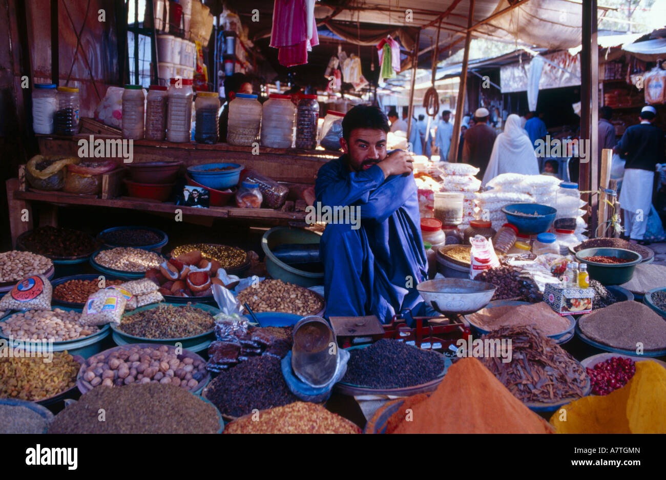 Portrait of market vendor sitting at market stall, Islamabad, Pakistan ...