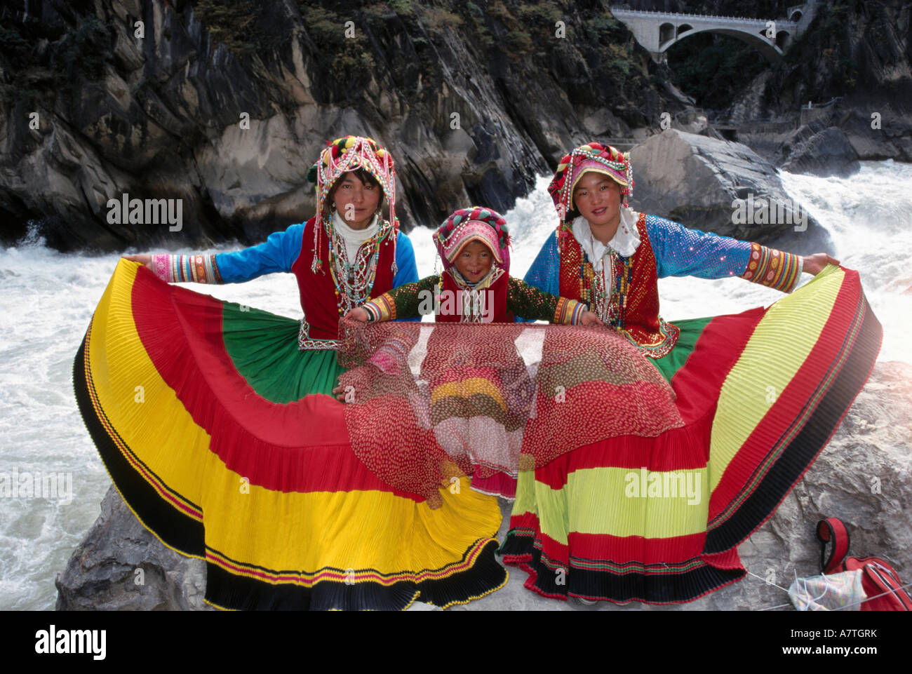 Portrait of three girls posing in traditional clothing Yangtze River ...