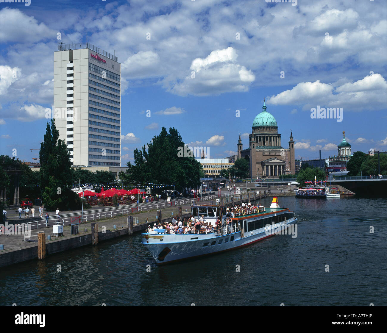 Tourists in boat at harbor Stock Photo - Alamy