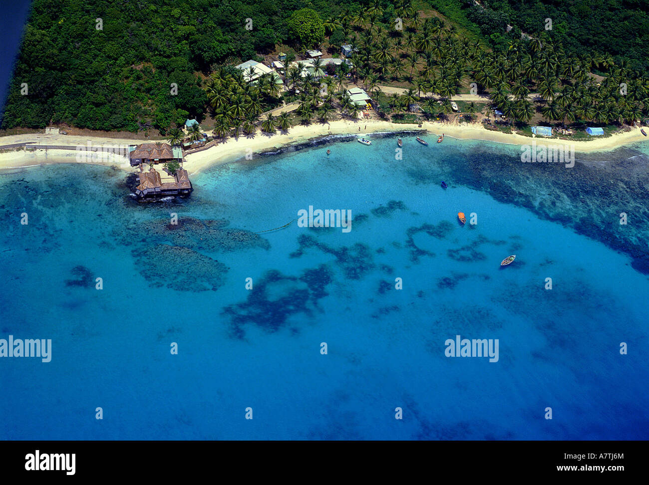 Aerial view of tourist resorts near coastline, Grenadines, Windward ...