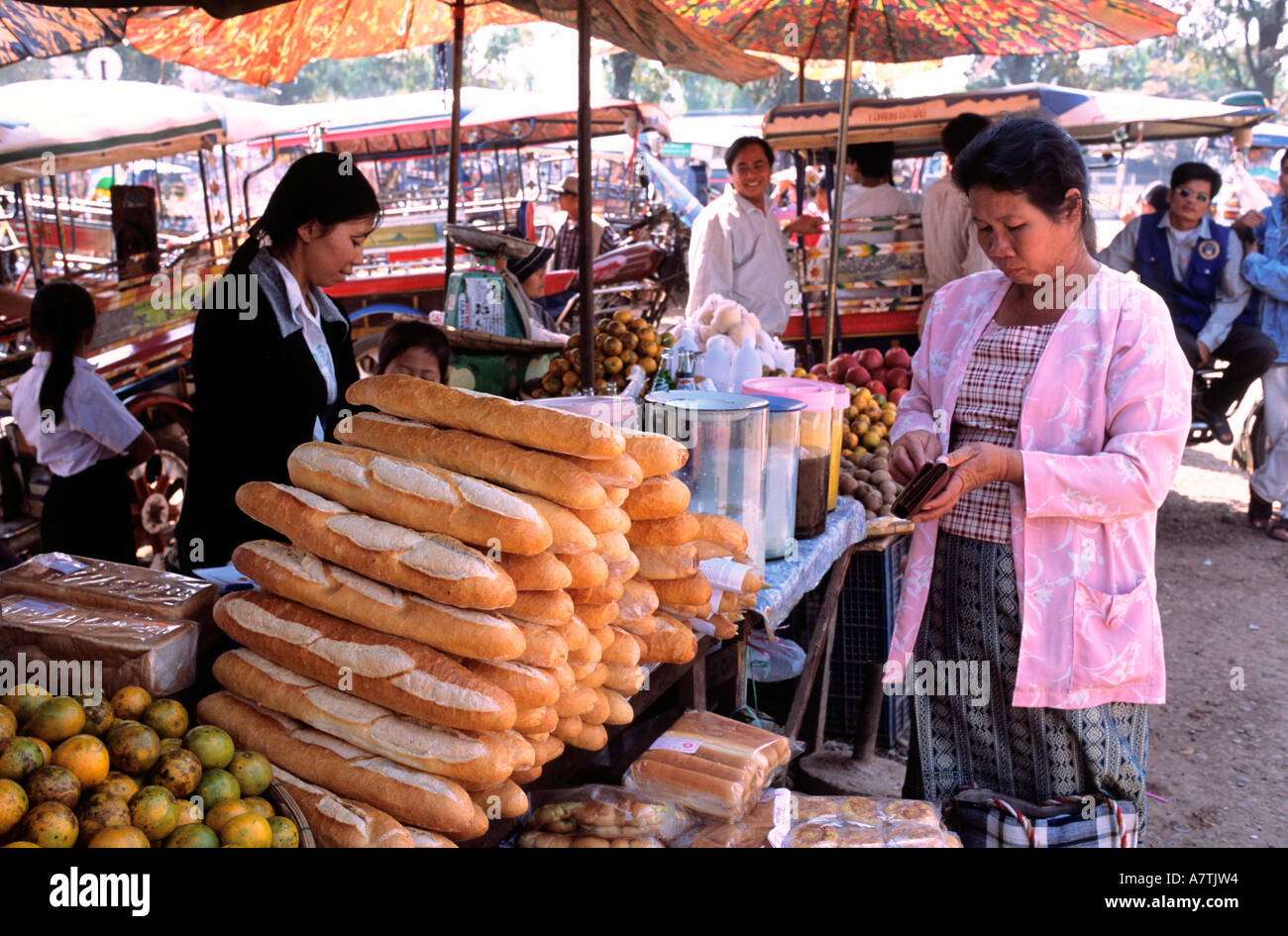 Laos, Vientiane, a French bread saleswoman Stock Photo - Alamy