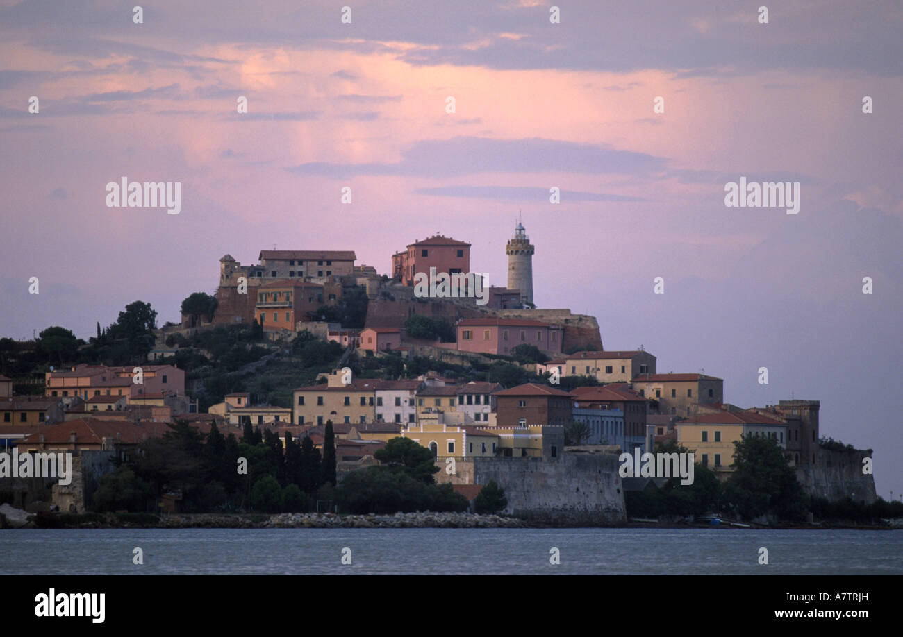 Town on hill against dusky sky, Isle Of Elba, Italy Stock Photo - Alamy
