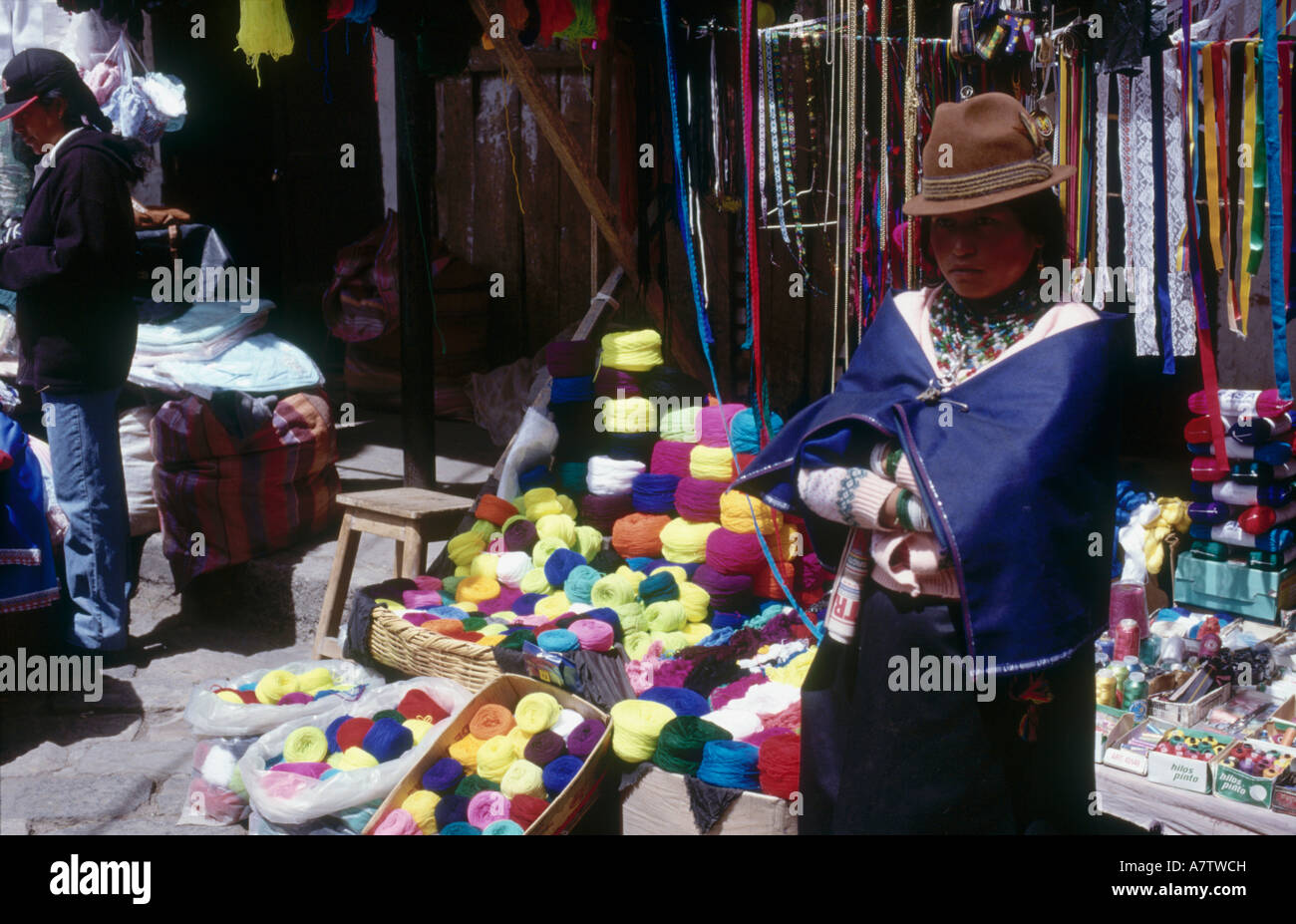 Portrait of female shopkeeper in front of market stall Guamote Ecuador ...