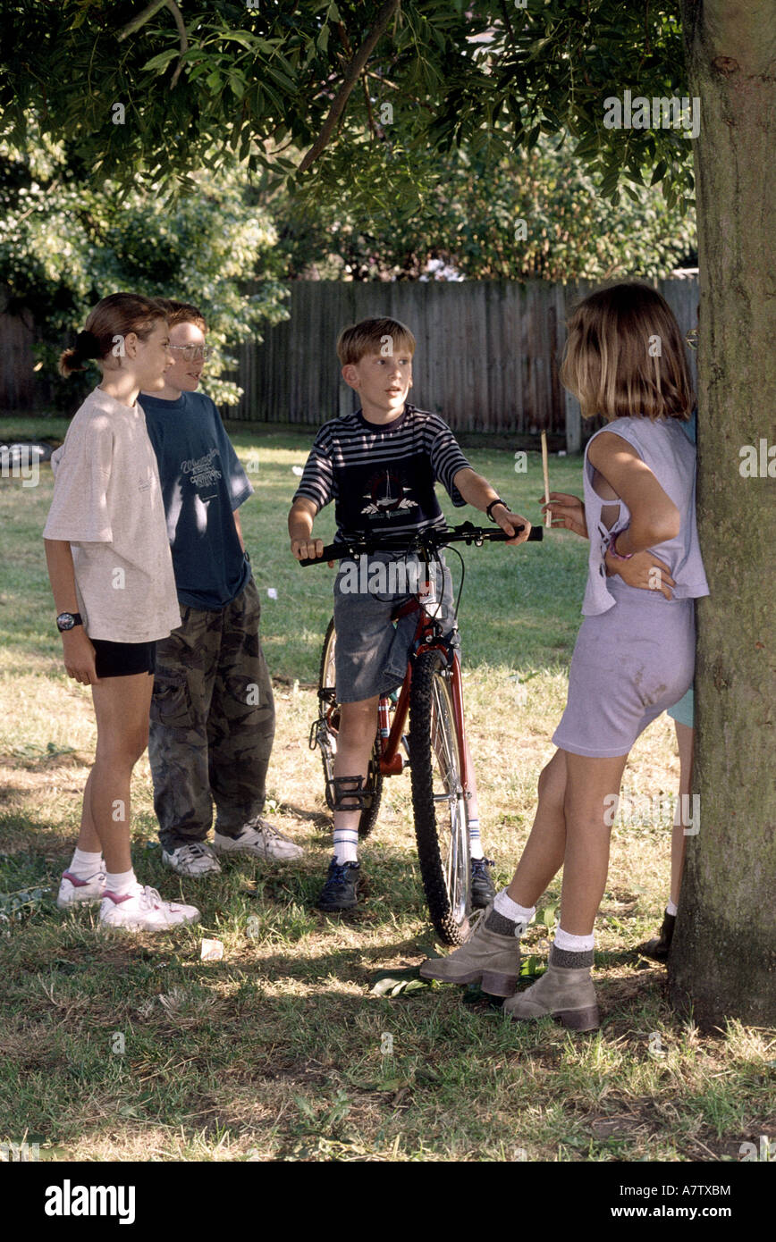 Children talking together in the park Stock Photo - Alamy