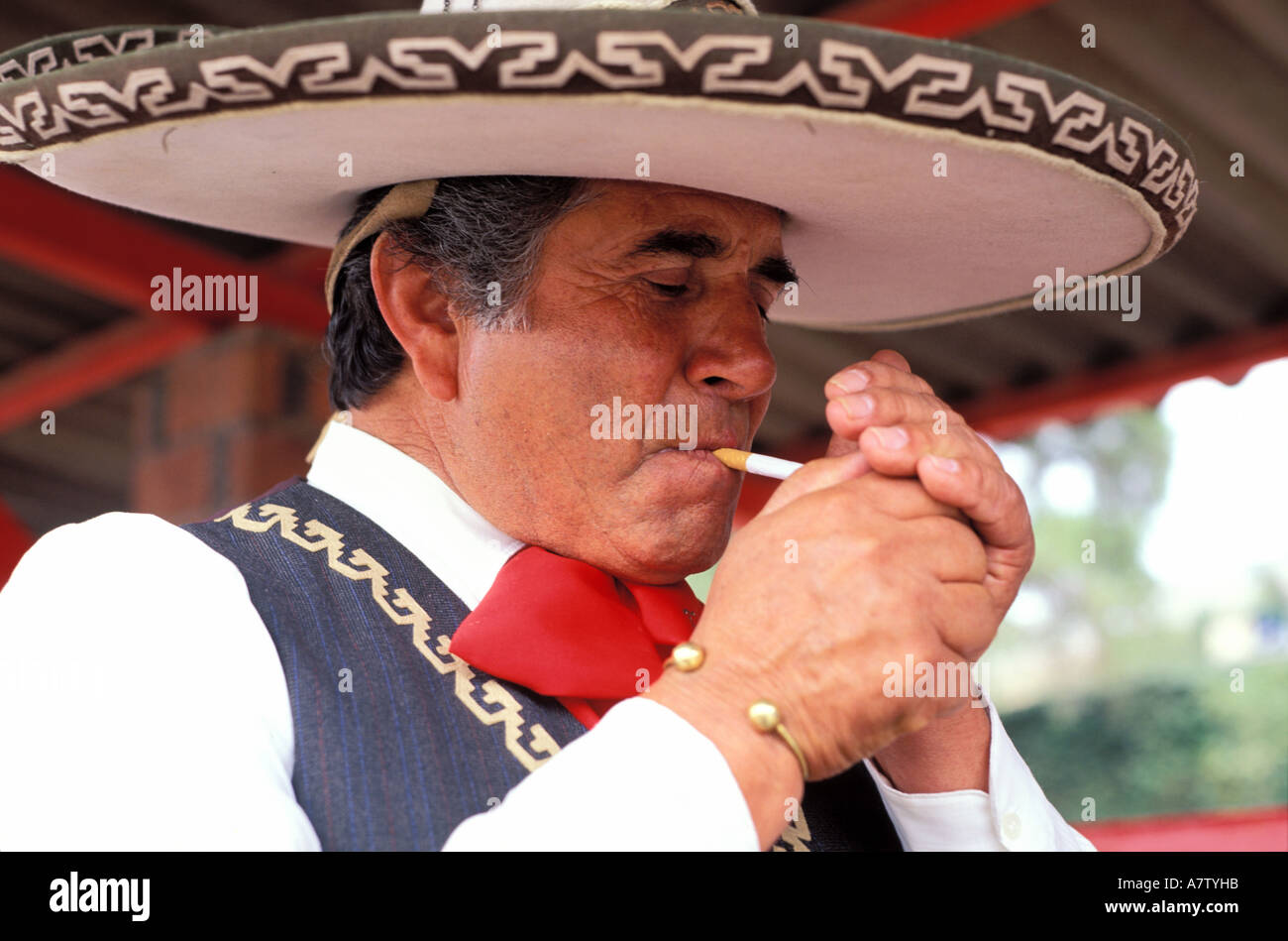 Mexico, Federal District, Mexico City, Charro rider lighting a ...