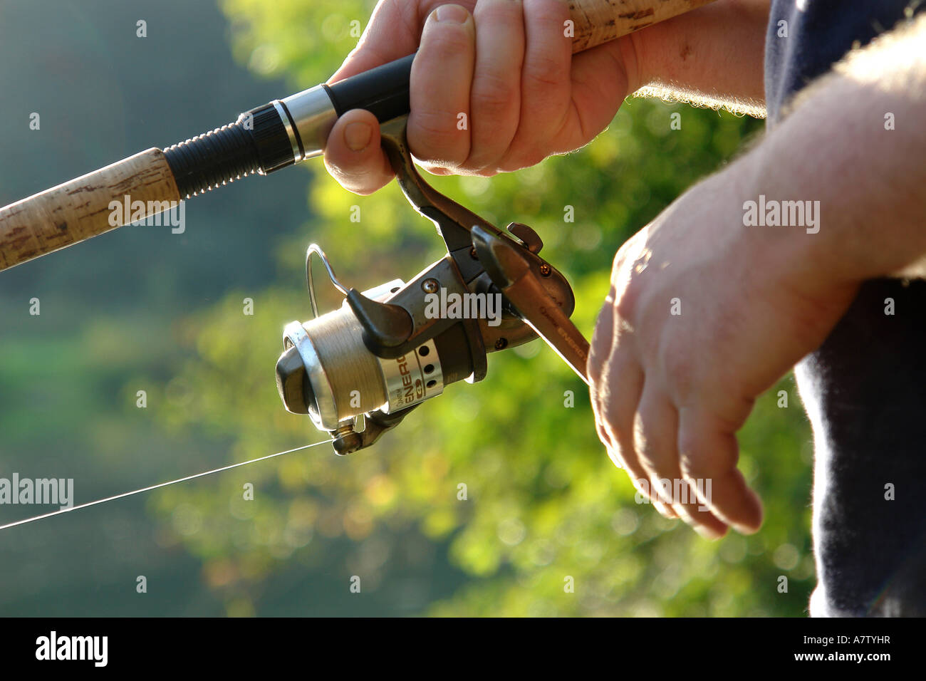 Man holding fishing rod, close-up Stock Photo - Alamy
